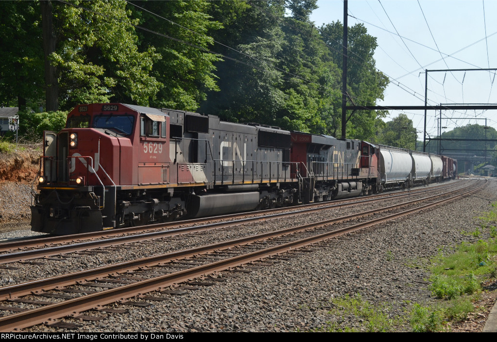 CN 5629 leads Q418-21 out of Woodbourne Yard